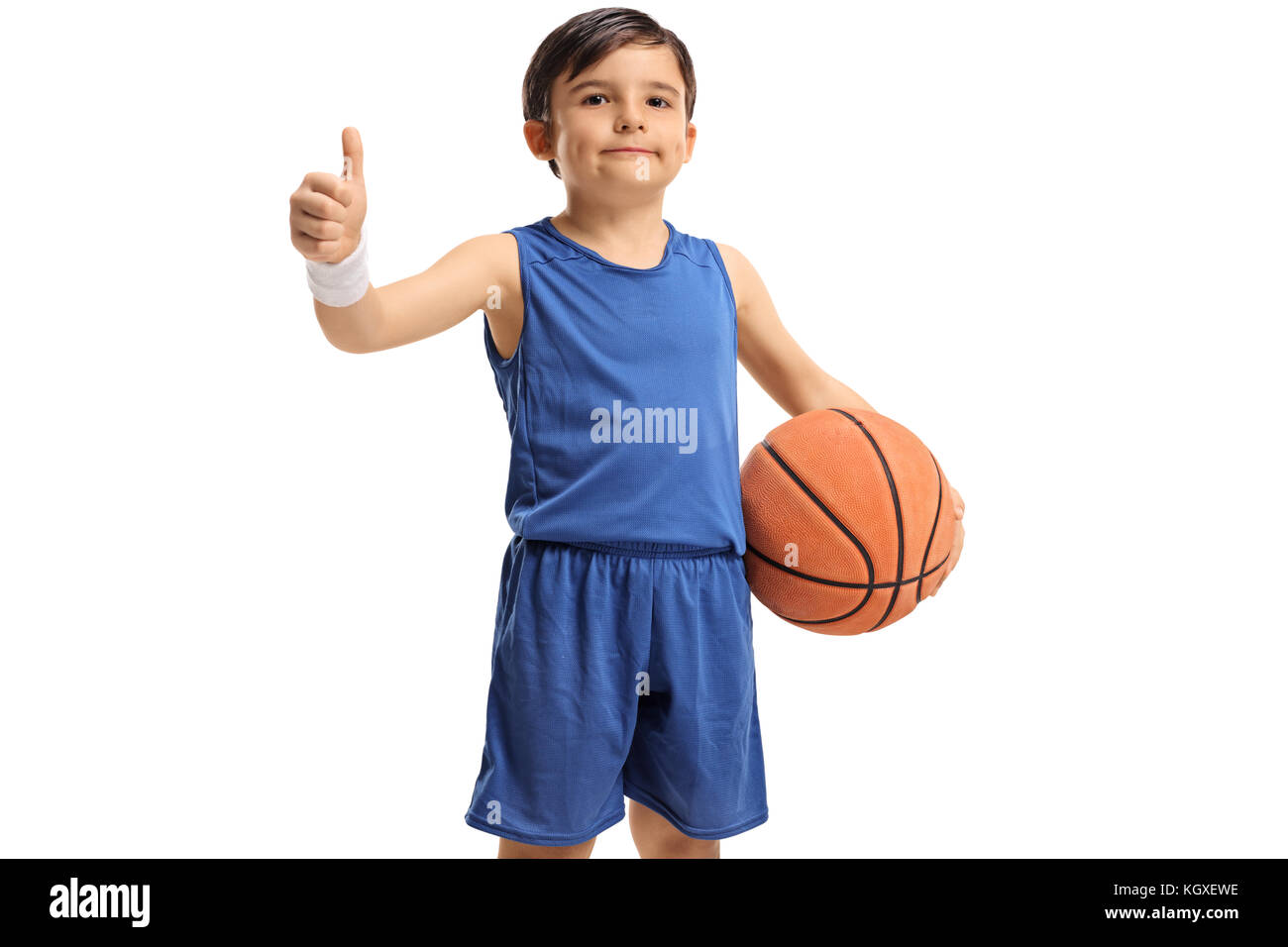 Little basketball player making a thumb up gesture isolated on white ...