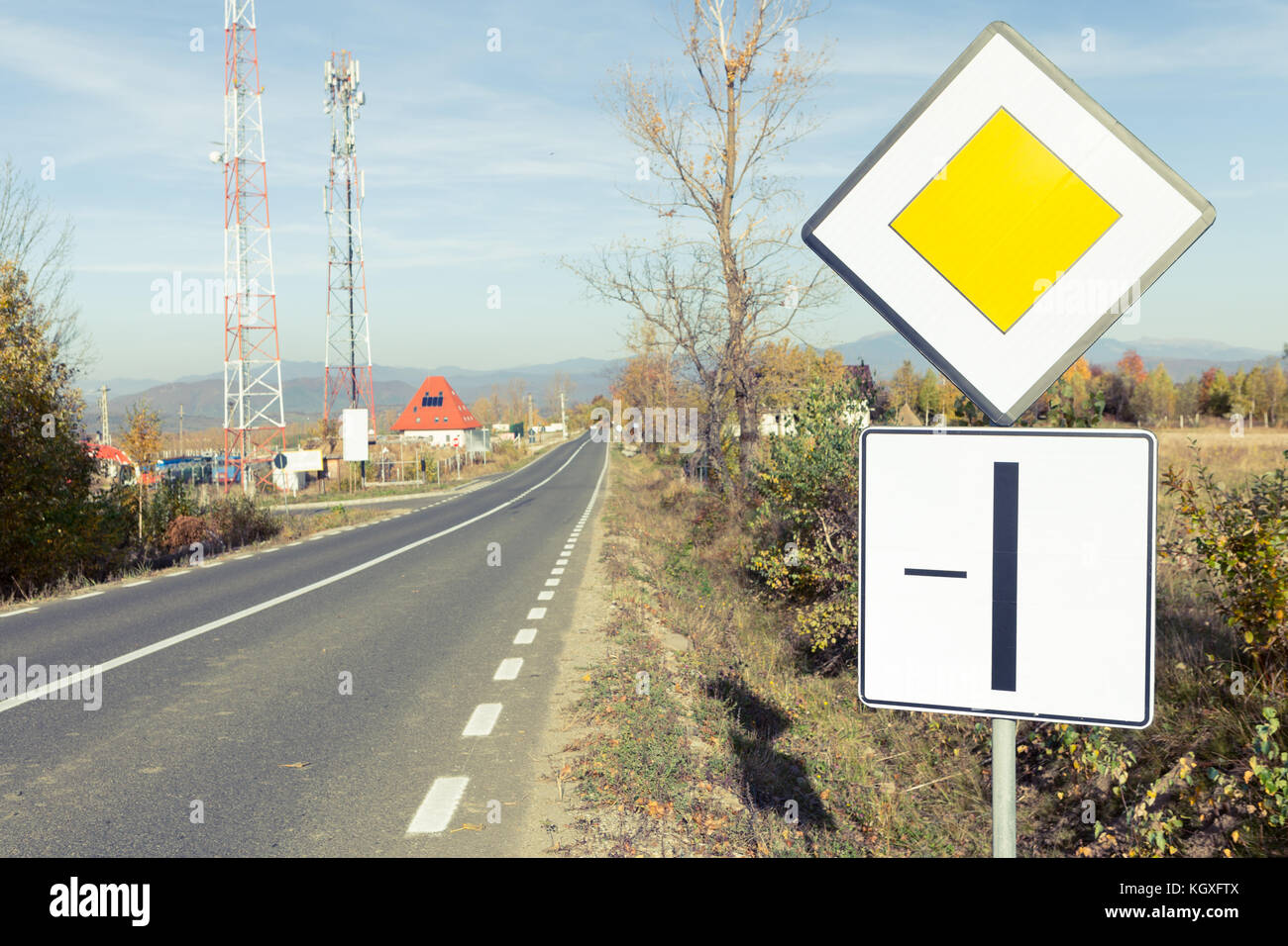 Side road with road sign priority hi-res stock photography and images ...