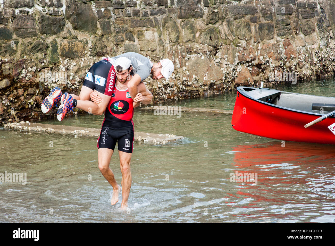Men carrying rowing boat hi-res stock photography and images - Alamy