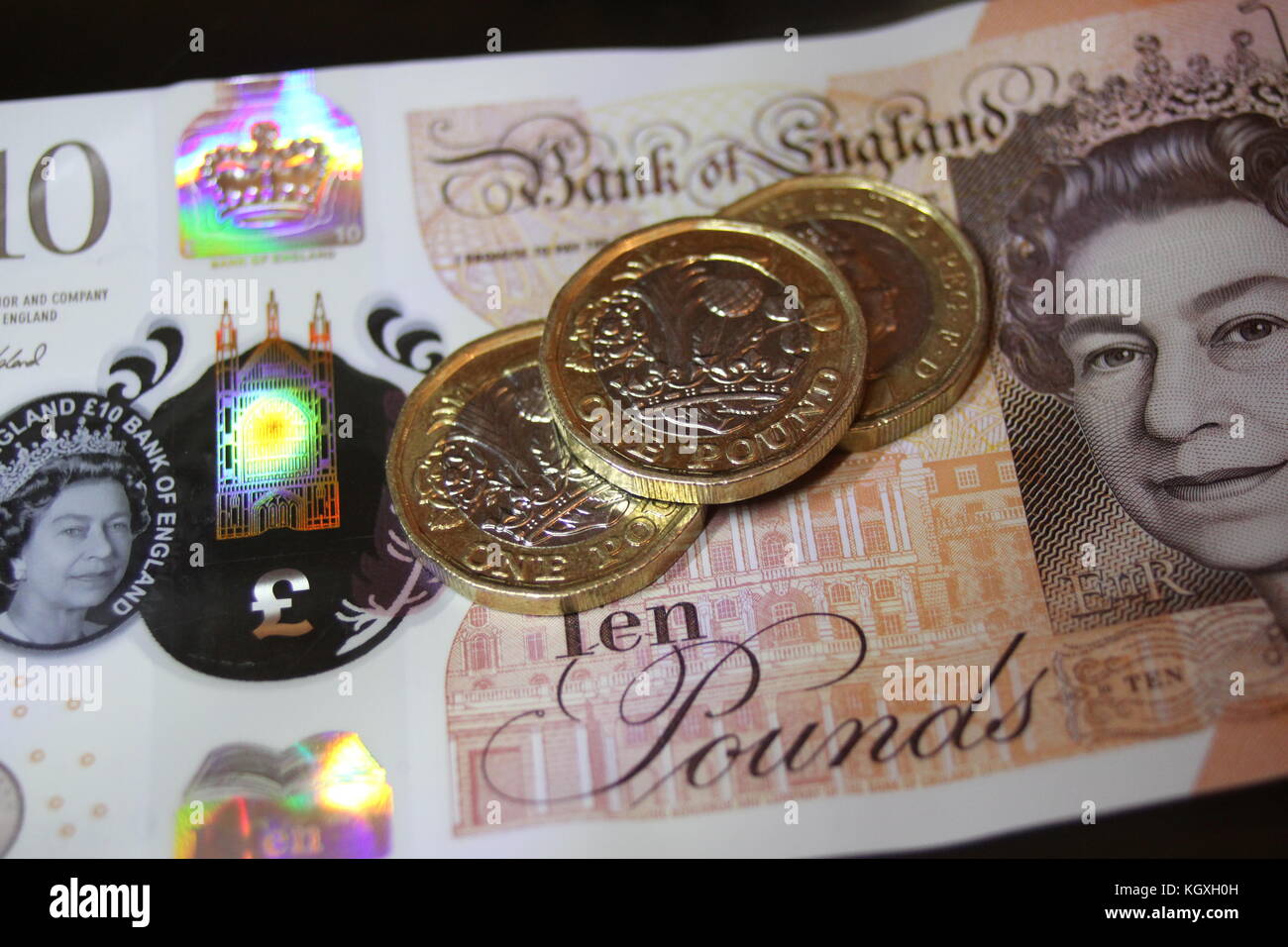 Ten one pound coin coins £ note money cash stirling financial ...