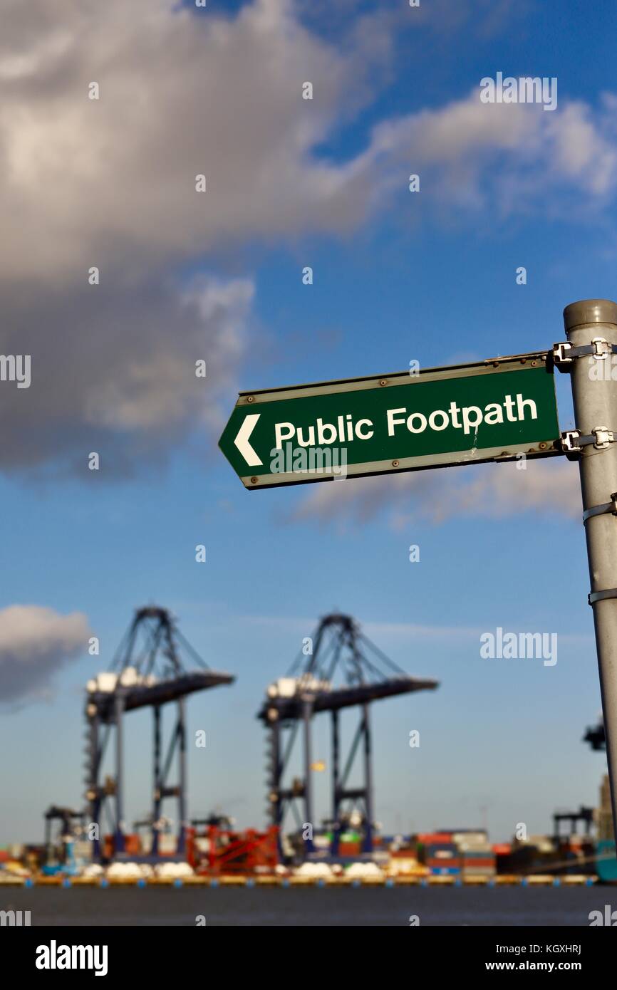 A green leaning Public Footpath sign by the River Orwell at Shotley ...