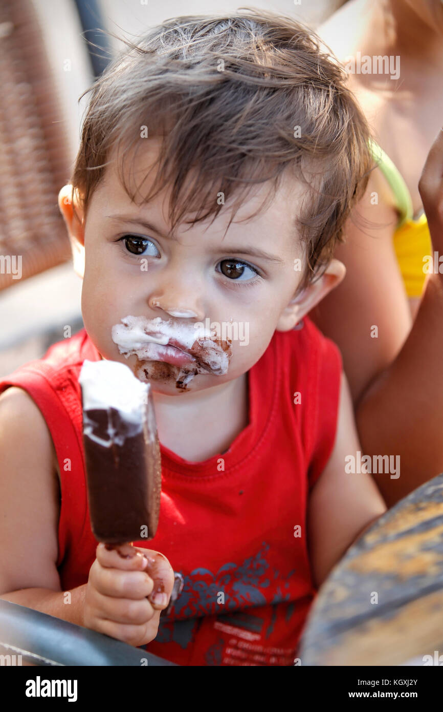 Young boy enjoying an ice cream Stock Photo - Alamy