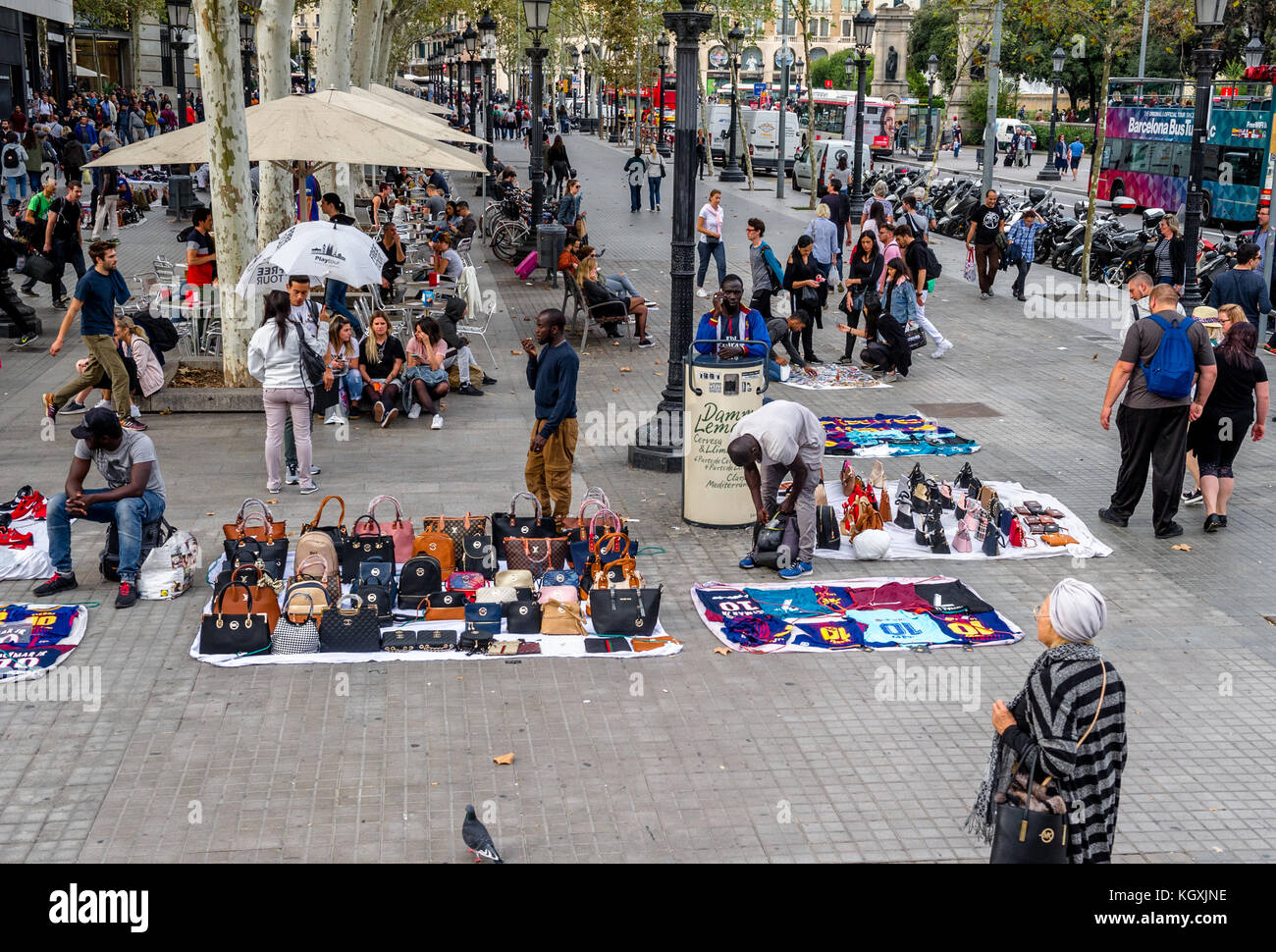 Street traders selling fake goods on the streets of Barcelona, Spain ...