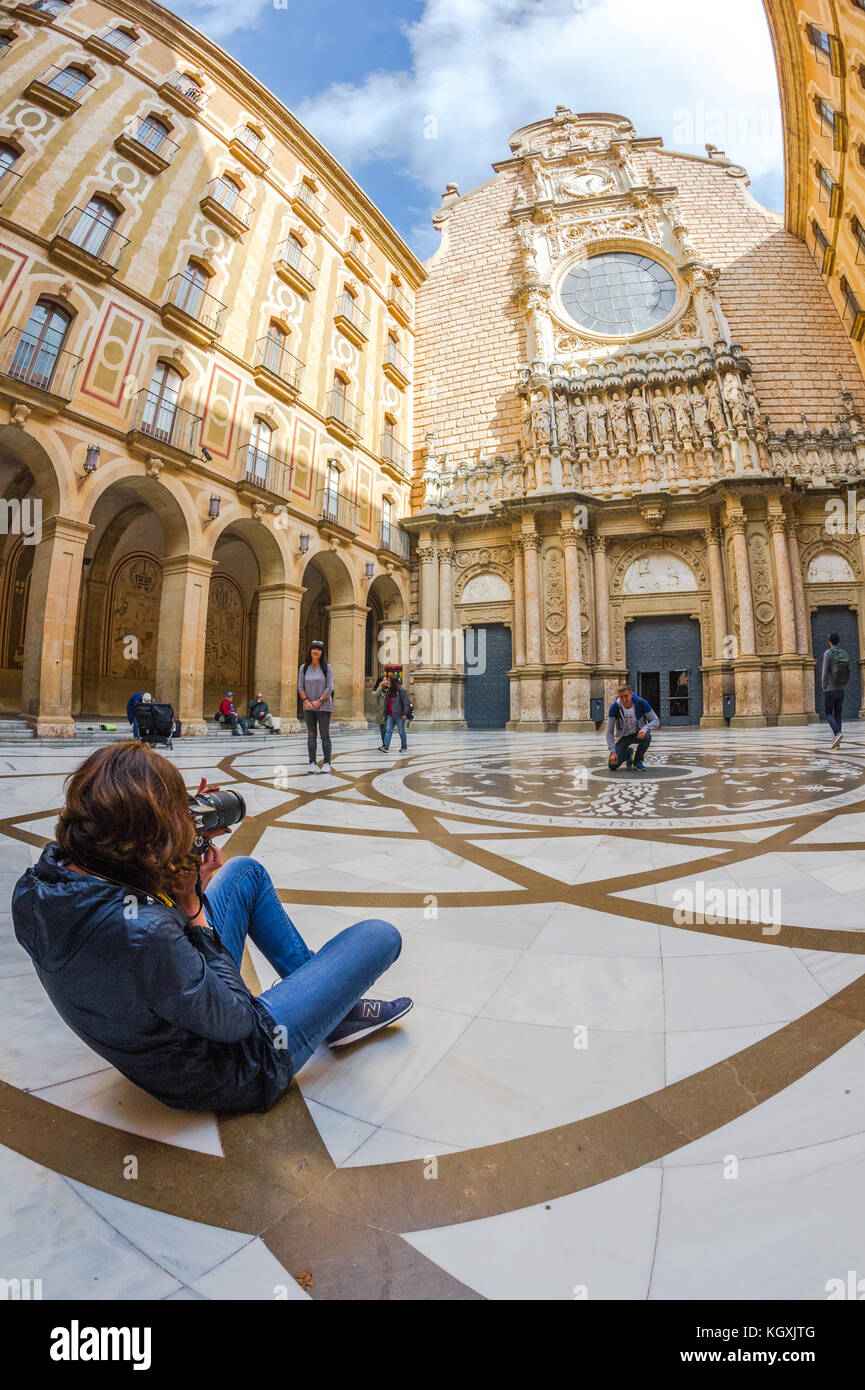 Tourists and visitors stand in the courtyard outside the Roman Catholic ...