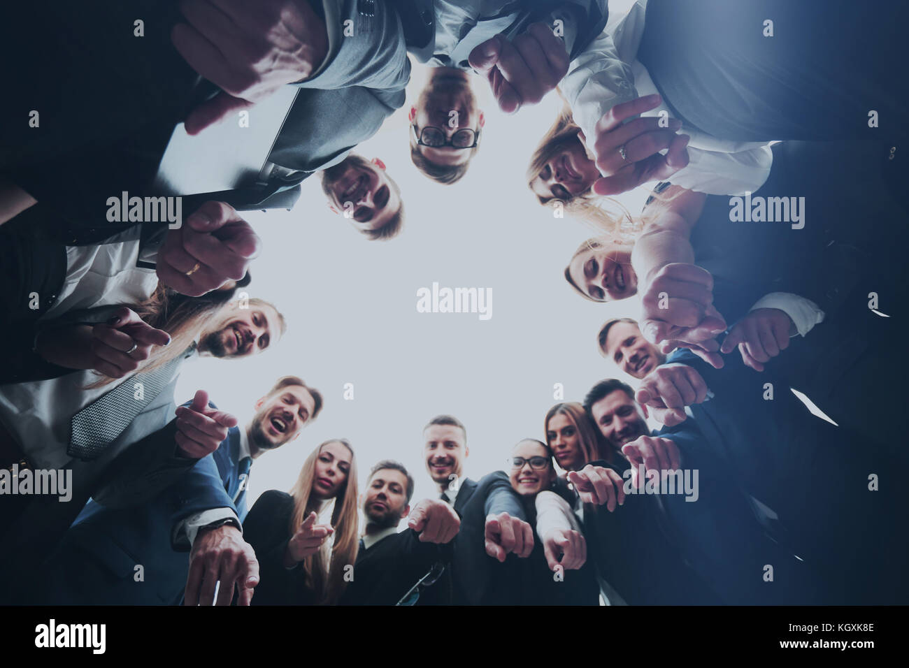Business team pointing at you in circle at office Stock Photo - Alamy