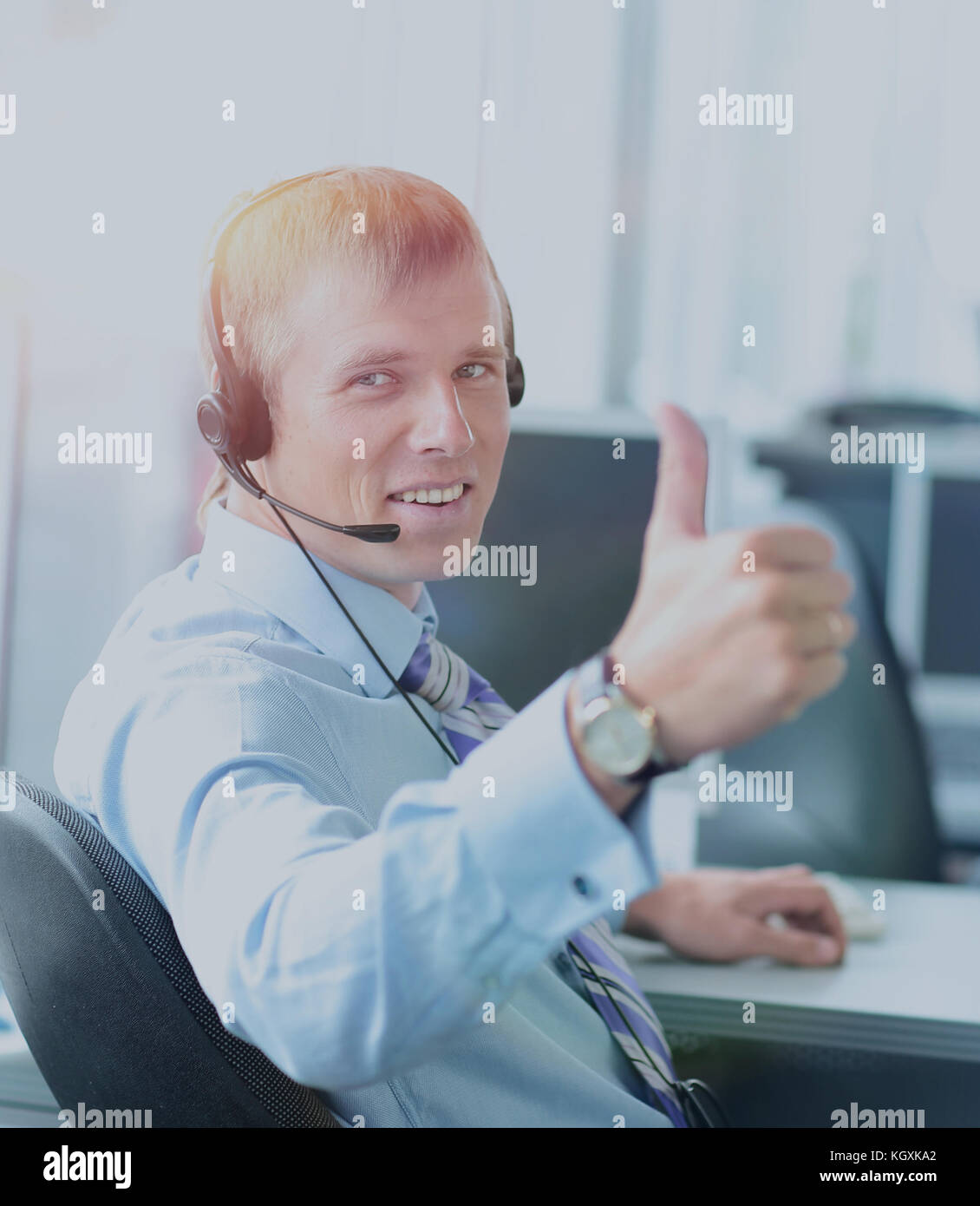 Happy business man working in an office Stock Photo - Alamy