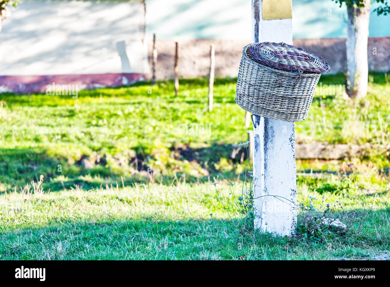 Eco Friendly trash bin in rural romanian village, from woven wicker ...