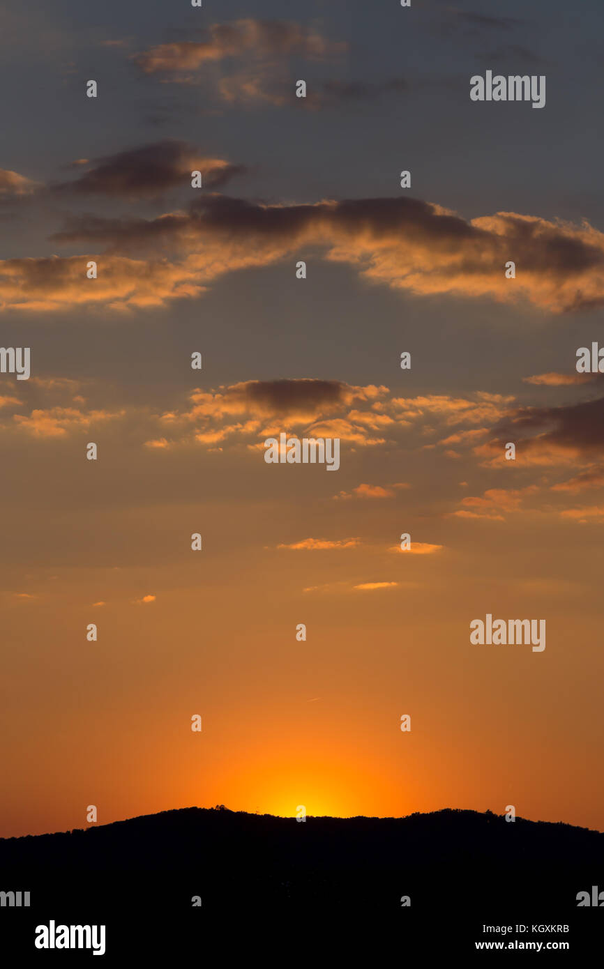 Beautiful sunset over the mountain Stock Photo - Alamy