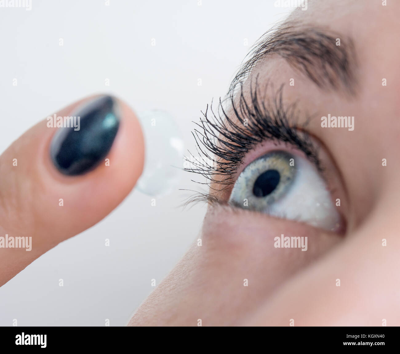 girl inserts a contact lens Stock Photo - Alamy