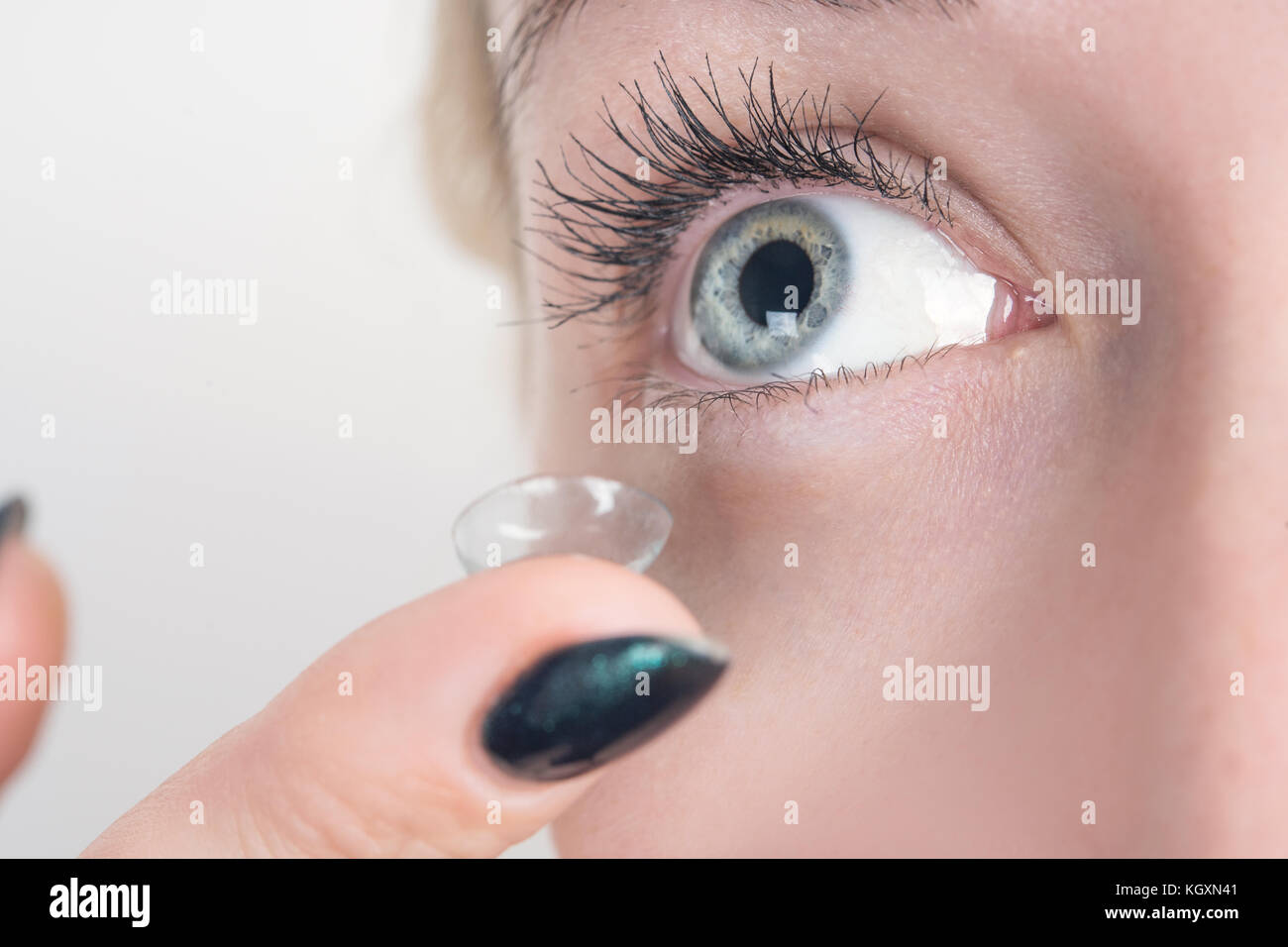 girl inserts a contact lens Stock Photo - Alamy