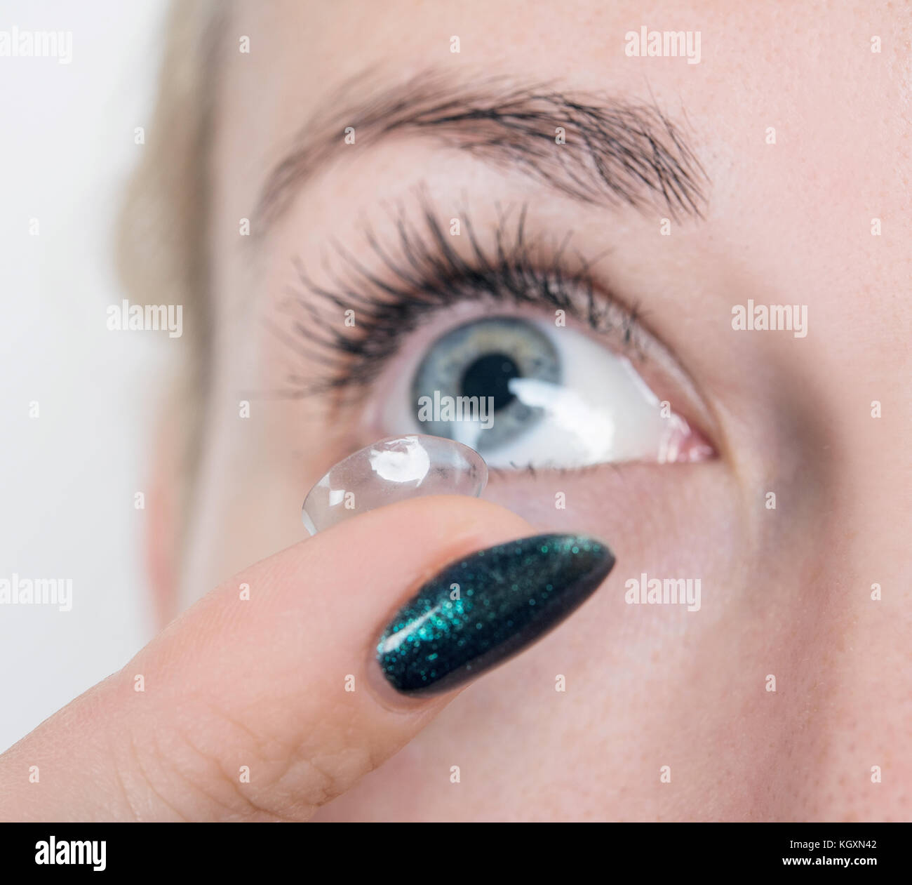 girl inserts a contact lens Stock Photo - Alamy