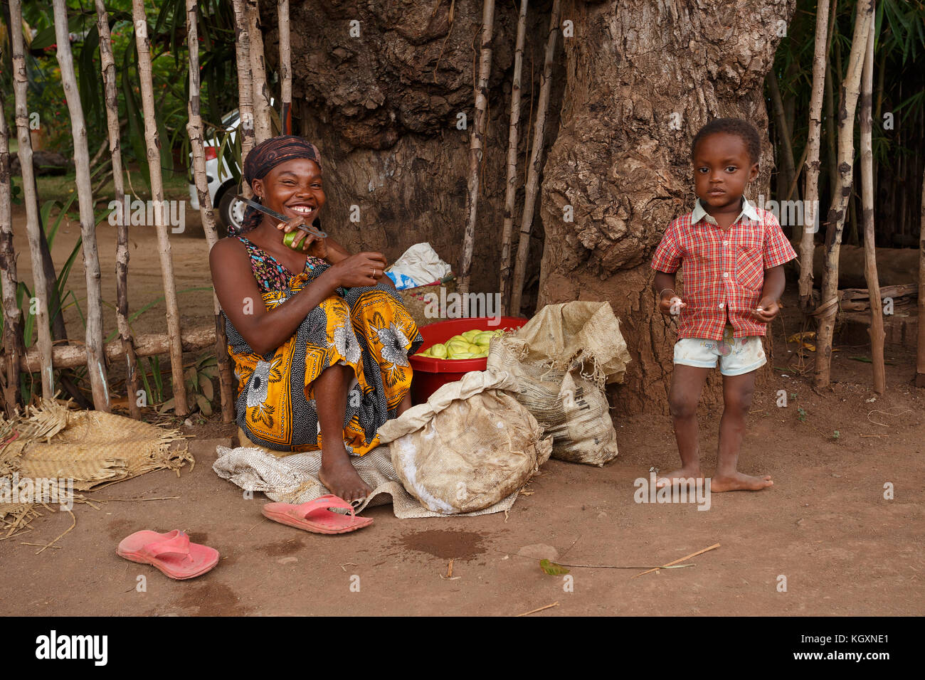 NOSY BE ,MADAGASCAR - NOVEMBER 3.2016 Malagasy woman with child selling ...