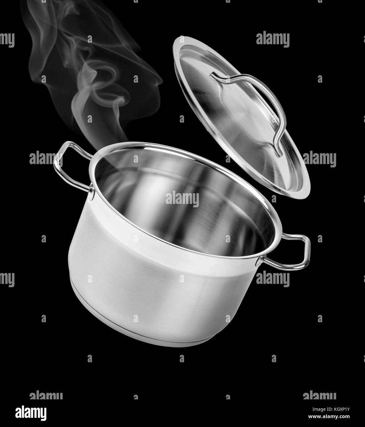 Cooking in the pot with lid isolated on black Stock Photo - Alamy