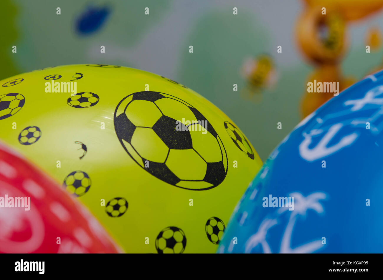 three balloons of different colors, football Stock Photo - Alamy