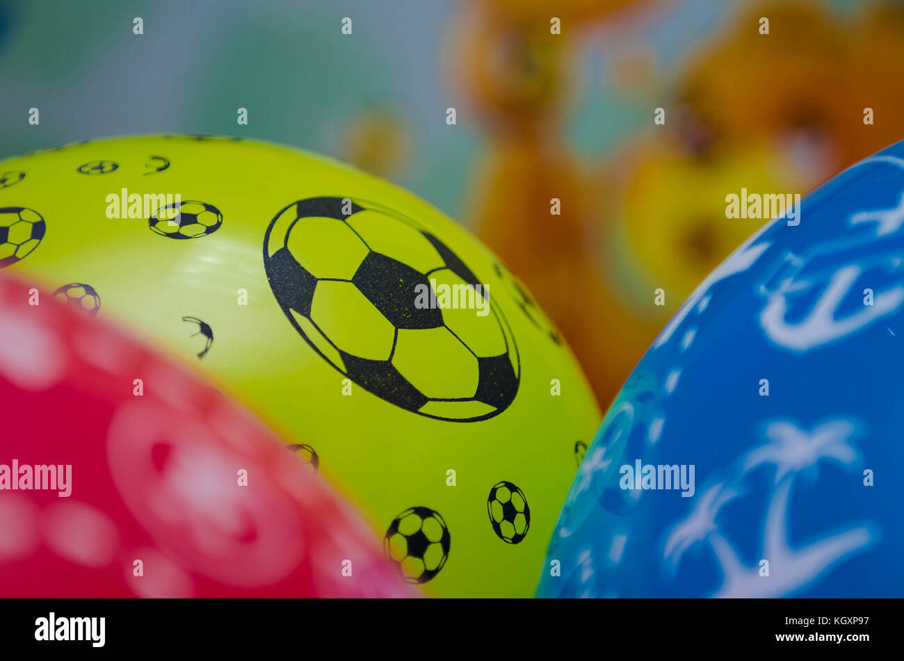 three balloons of different colors, football Stock Photo - Alamy
