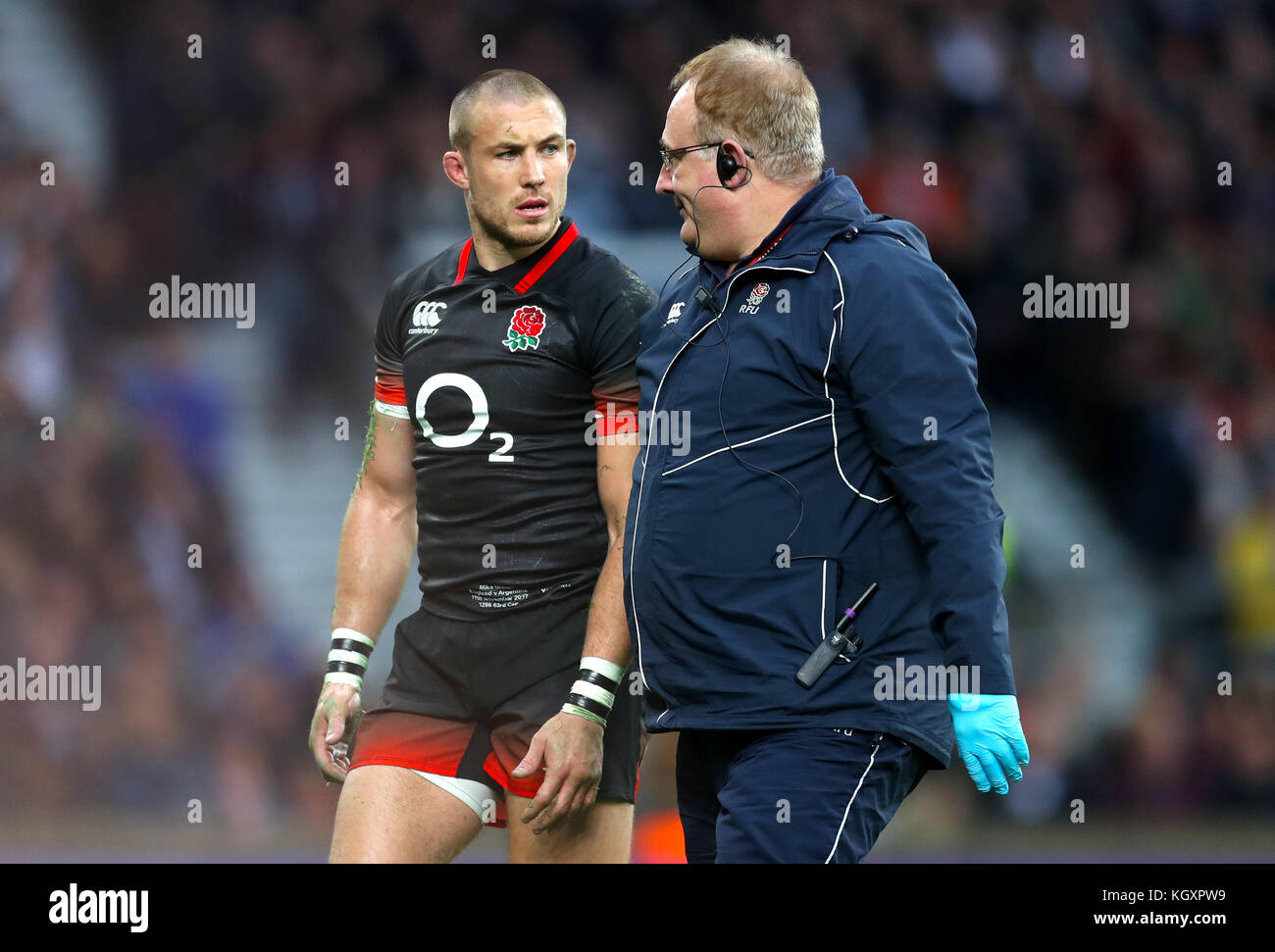 England's Mike Brown gleave the pitch with a possible head injury ...