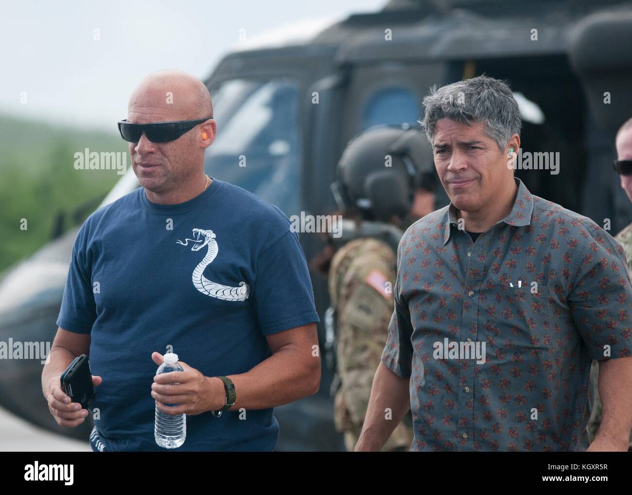 Actors Greg Duncan (left) and Esai Morales help U.S. soldiers deliver ...