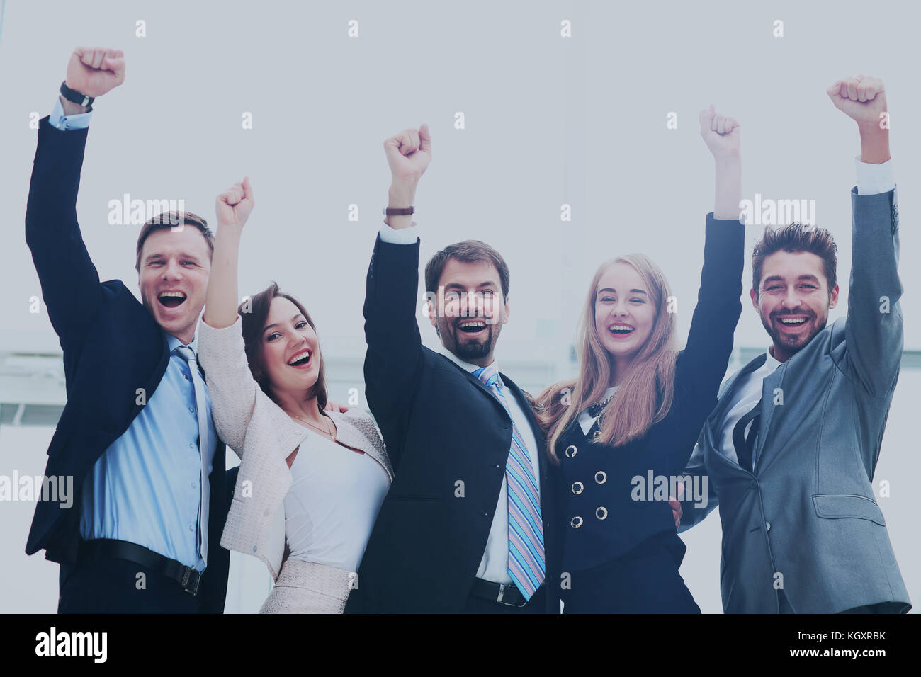 Business team celebrating a triumph with arms up Stock Photo - Alamy