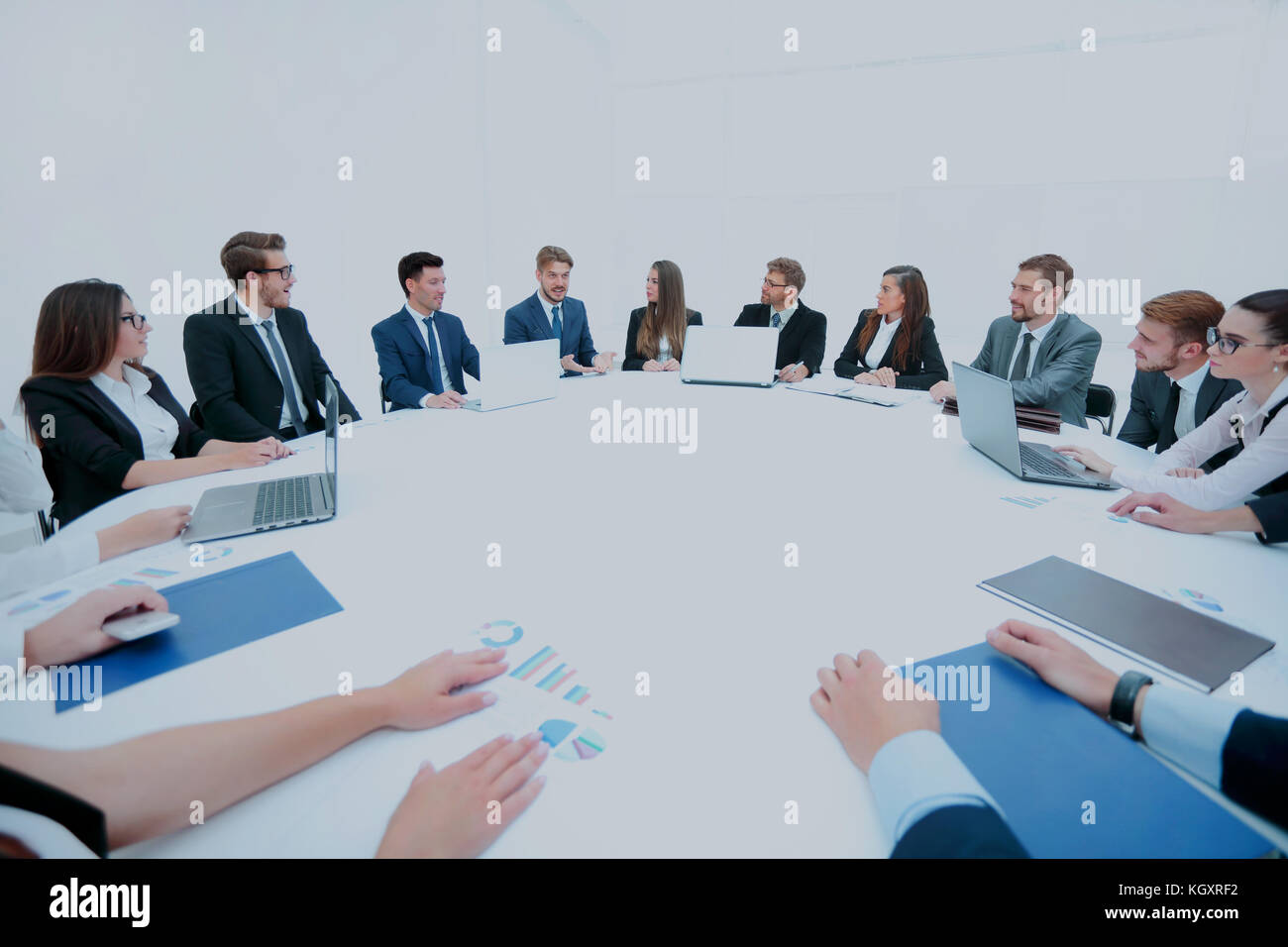 Business team, sitting at athe round table on white background Stock ...