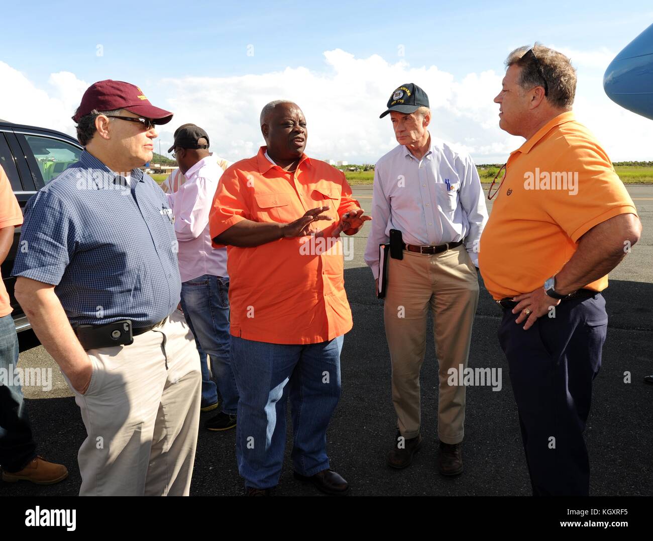 U.S. Virgin Islands Governor Kenneth Mapp (second from left) speaks to ...