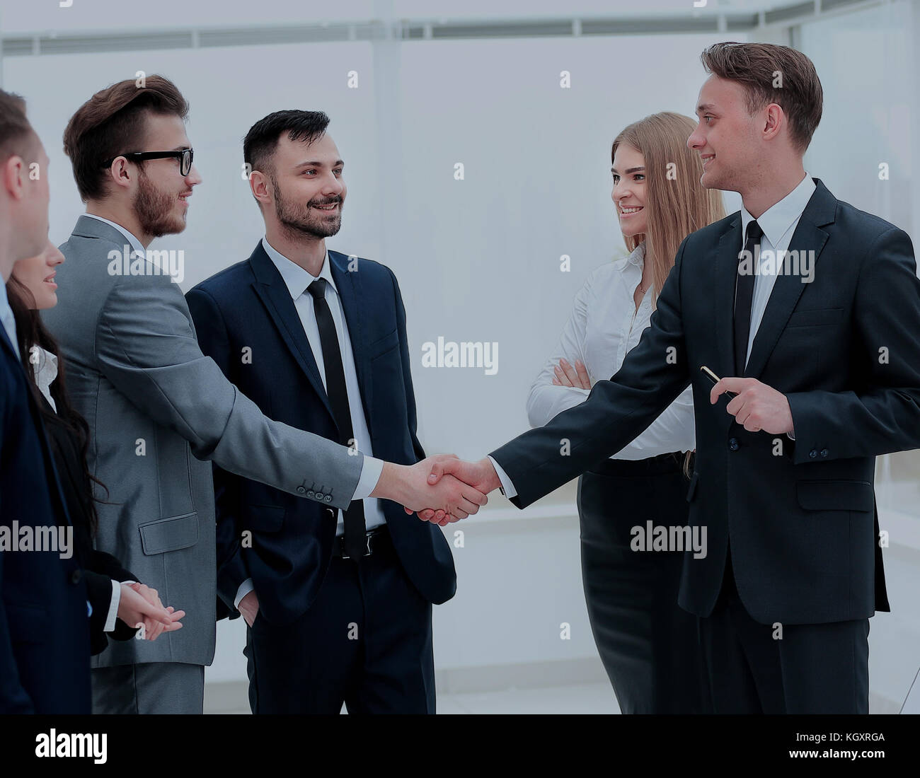 businessmen handshaking after presentation Stock Photo - Alamy