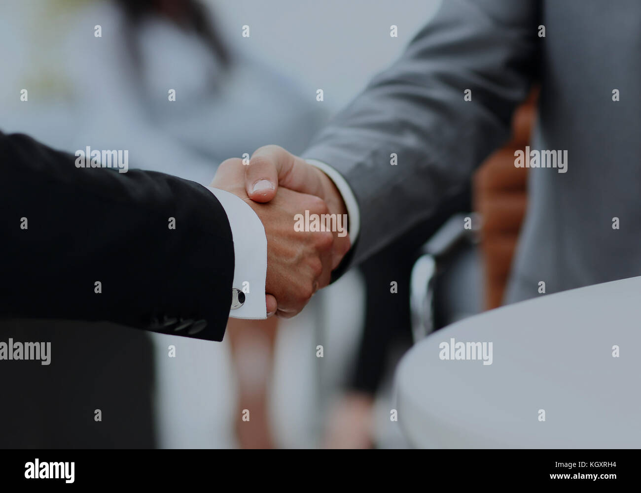 Men shaking hands professional over document hi-res stock photography ...