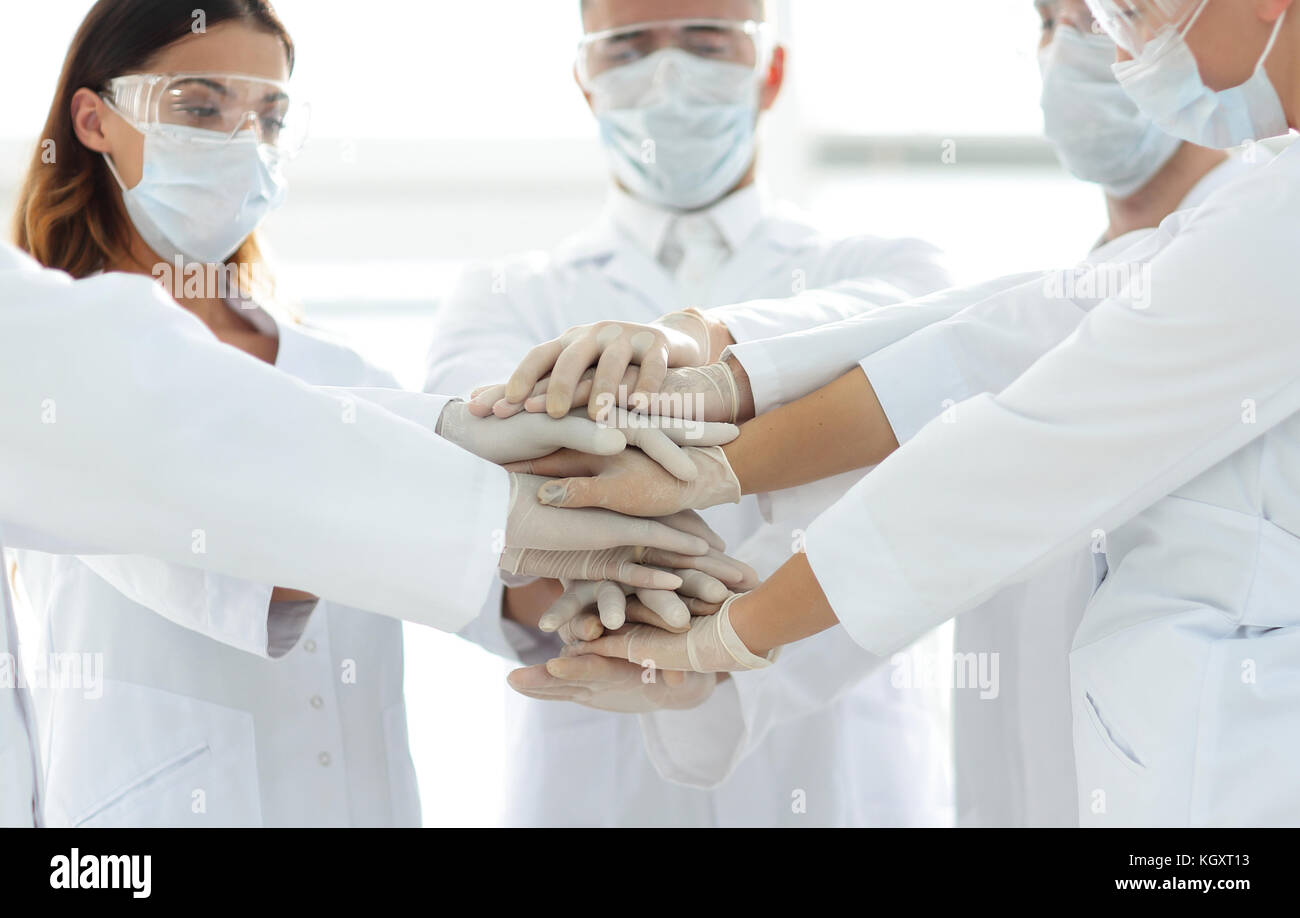 Close-up Photo Of Doctors Stacking Hand With Coworkers Stock Photo - Alamy