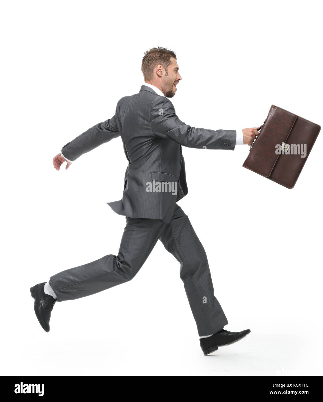 side view.cheerful businessman with briefcase stepping forward Stock ...