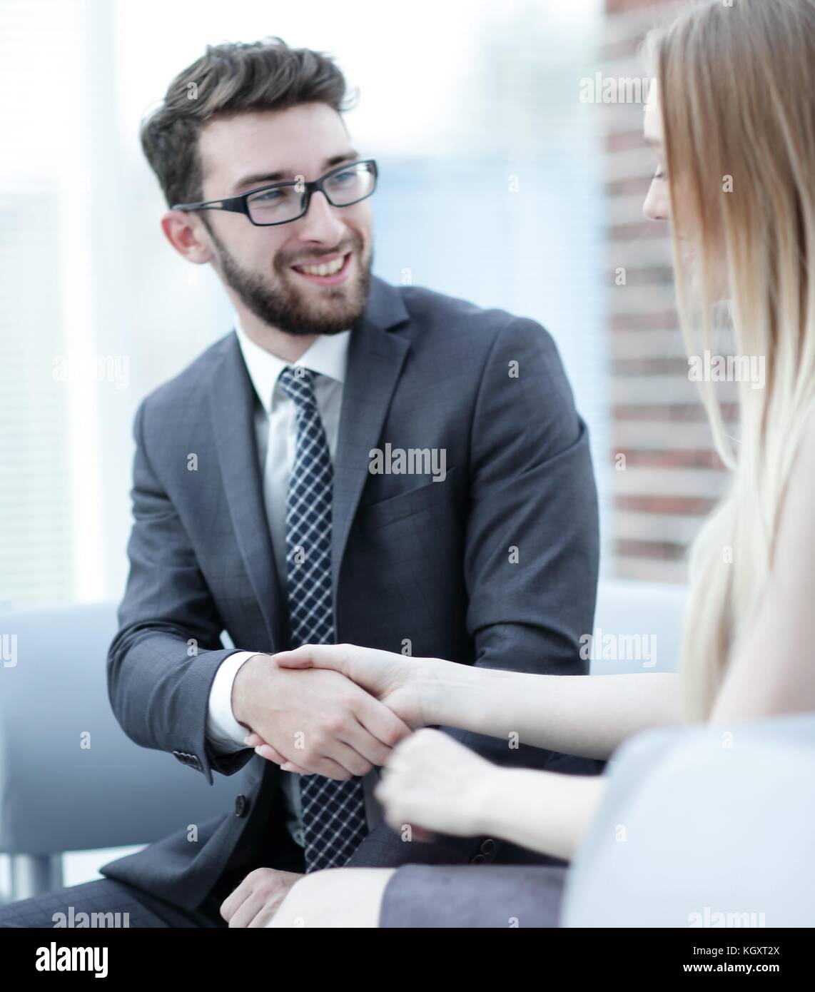 close-up of a manager shakes hands with a regular customer Stock Photo ...