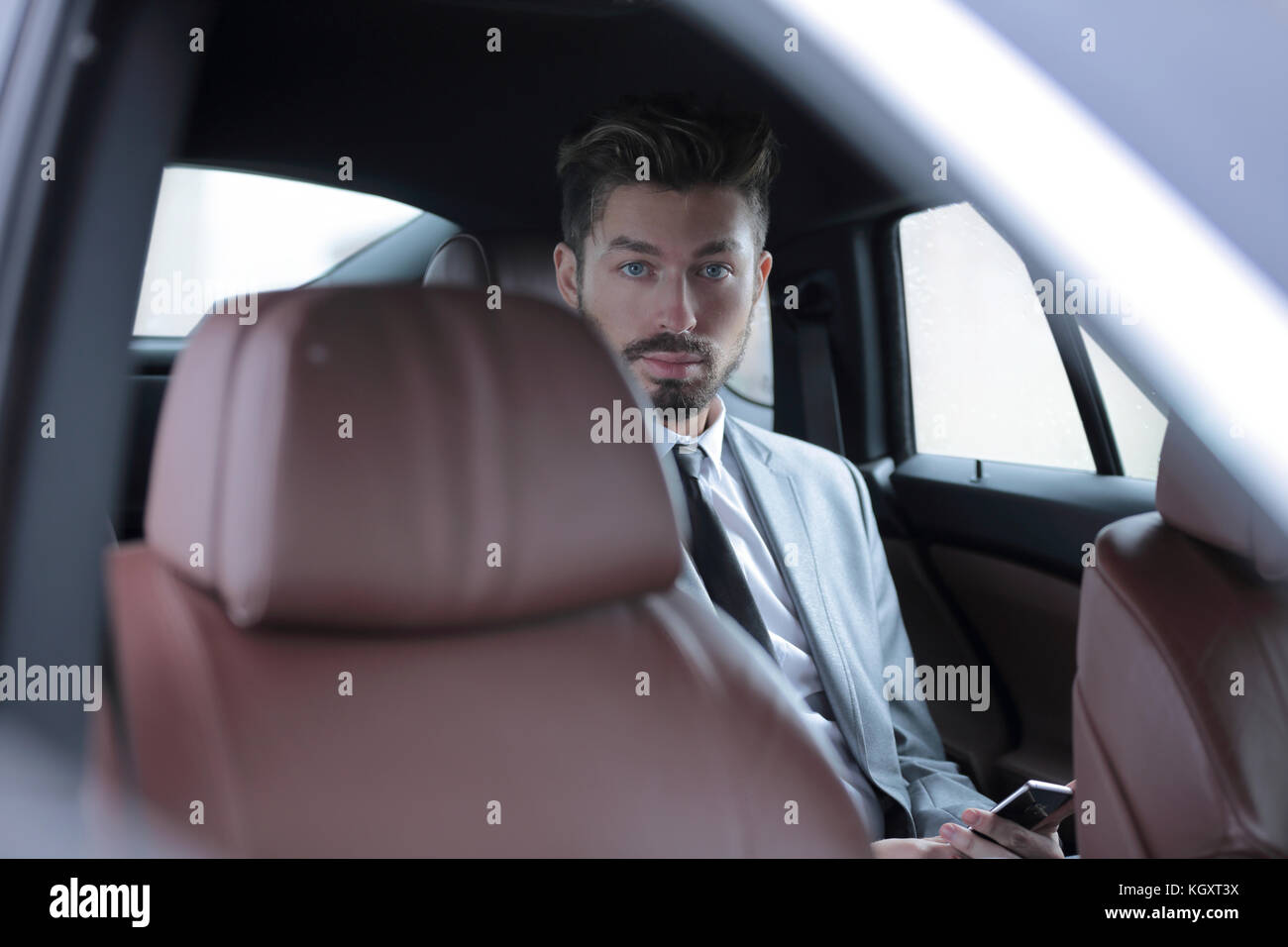 Handsome business man in car Stock Photo - Alamy