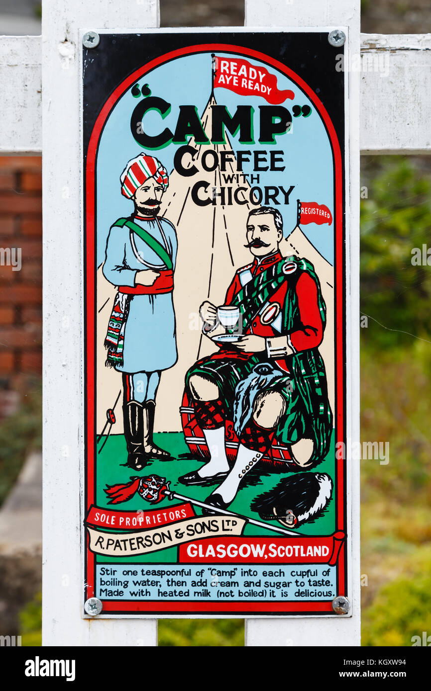 Old style tin advertising board for Camp Coffee displayed on a painted ...