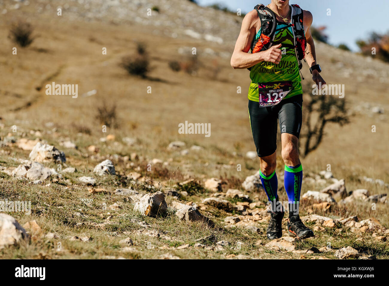 man athlete runner running on mountain trail during Crimea Х Run Stock ...