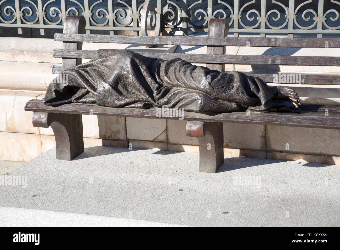 Homeless Jesus sculpture by the cathedral, Madrid city centre, Spain ...