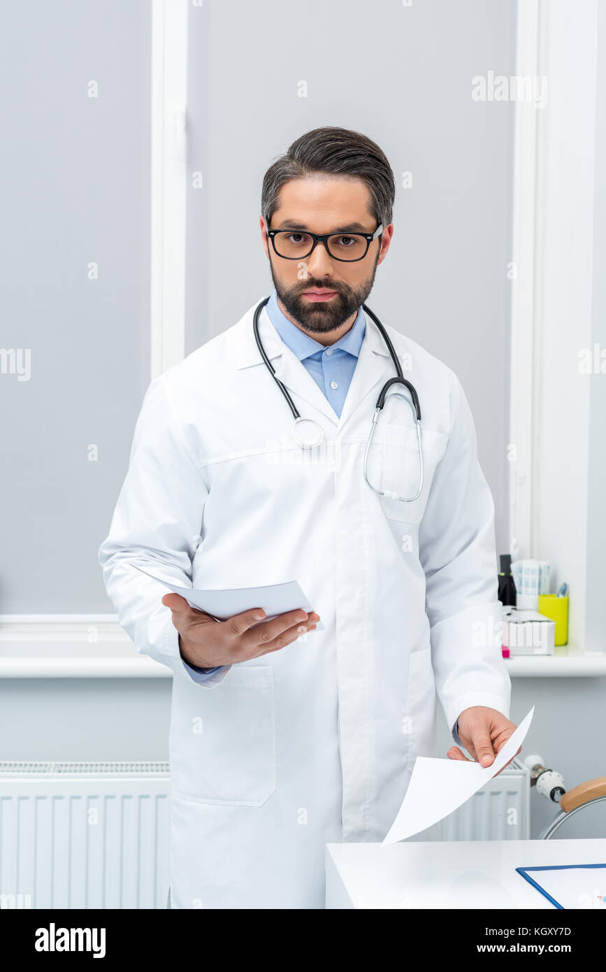 general practitioner with documents Stock Photo - Alamy