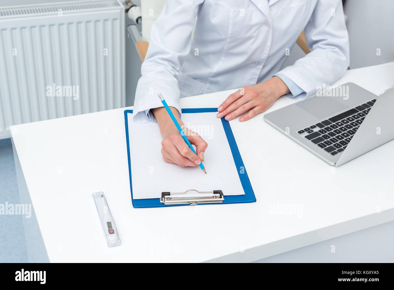 writing in clipboard Stock Photo - Alamy