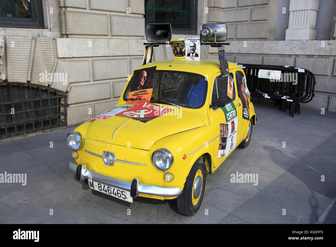 Small yellow SEAT car megaphones and political posters, Madrid city ...