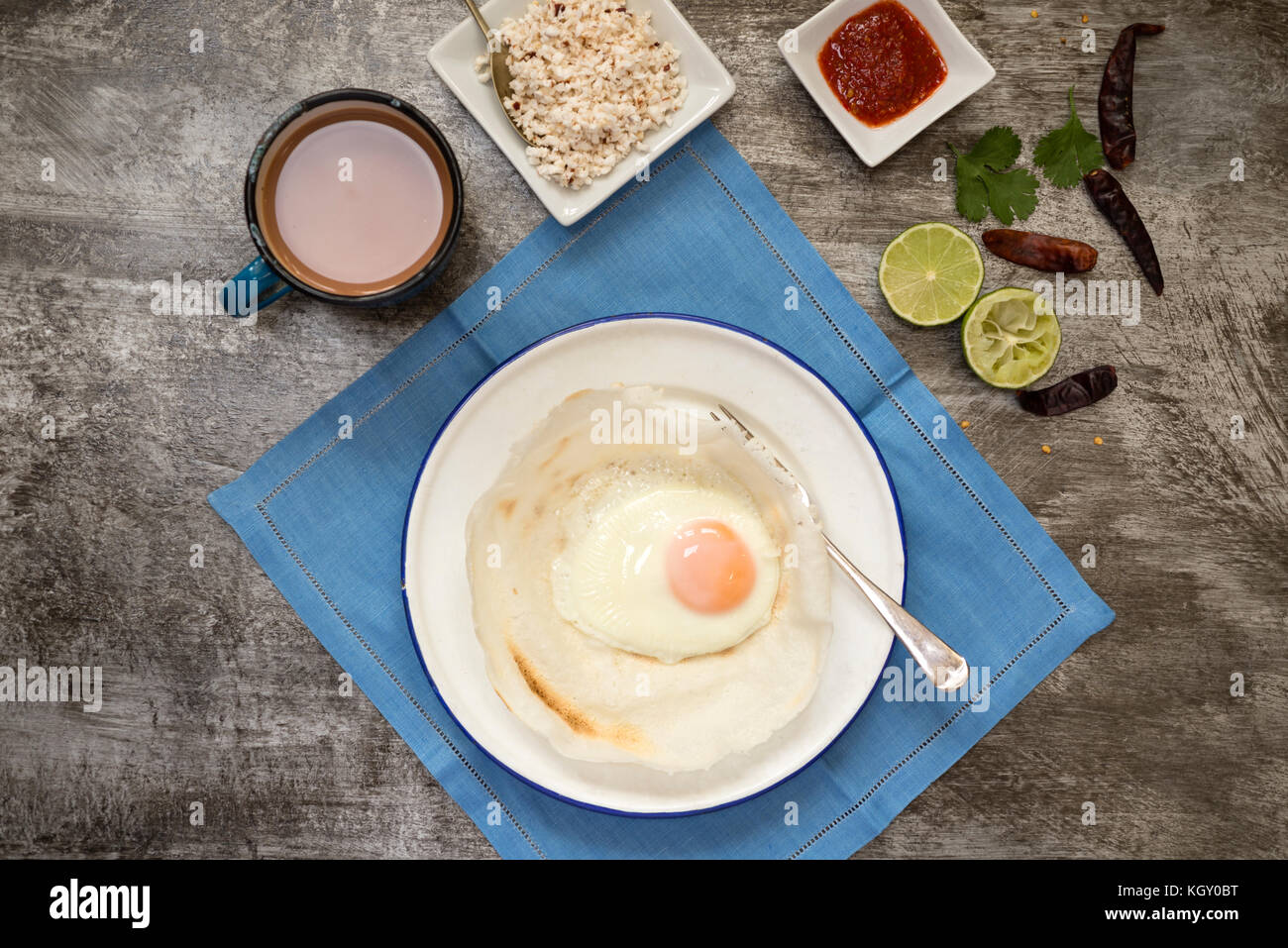 Sri Lankan hoppers with egg, served with coconut sambol and chilli ...
