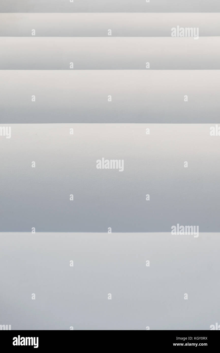 Gray-white background with horizontal gradient stripes, which narrow in ...