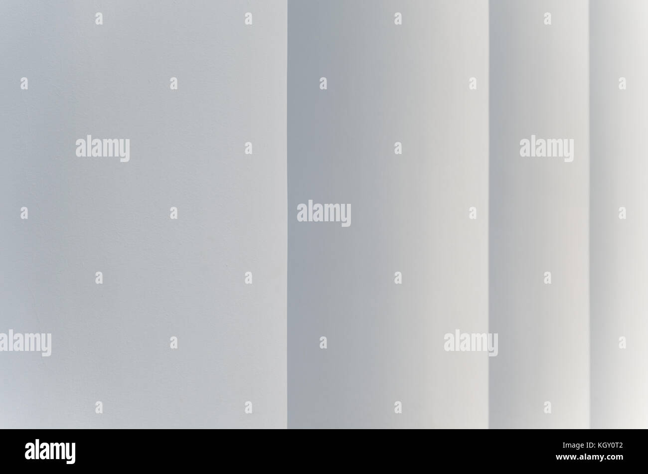 Light gray abstract background with vertical stripes that taper in the ...