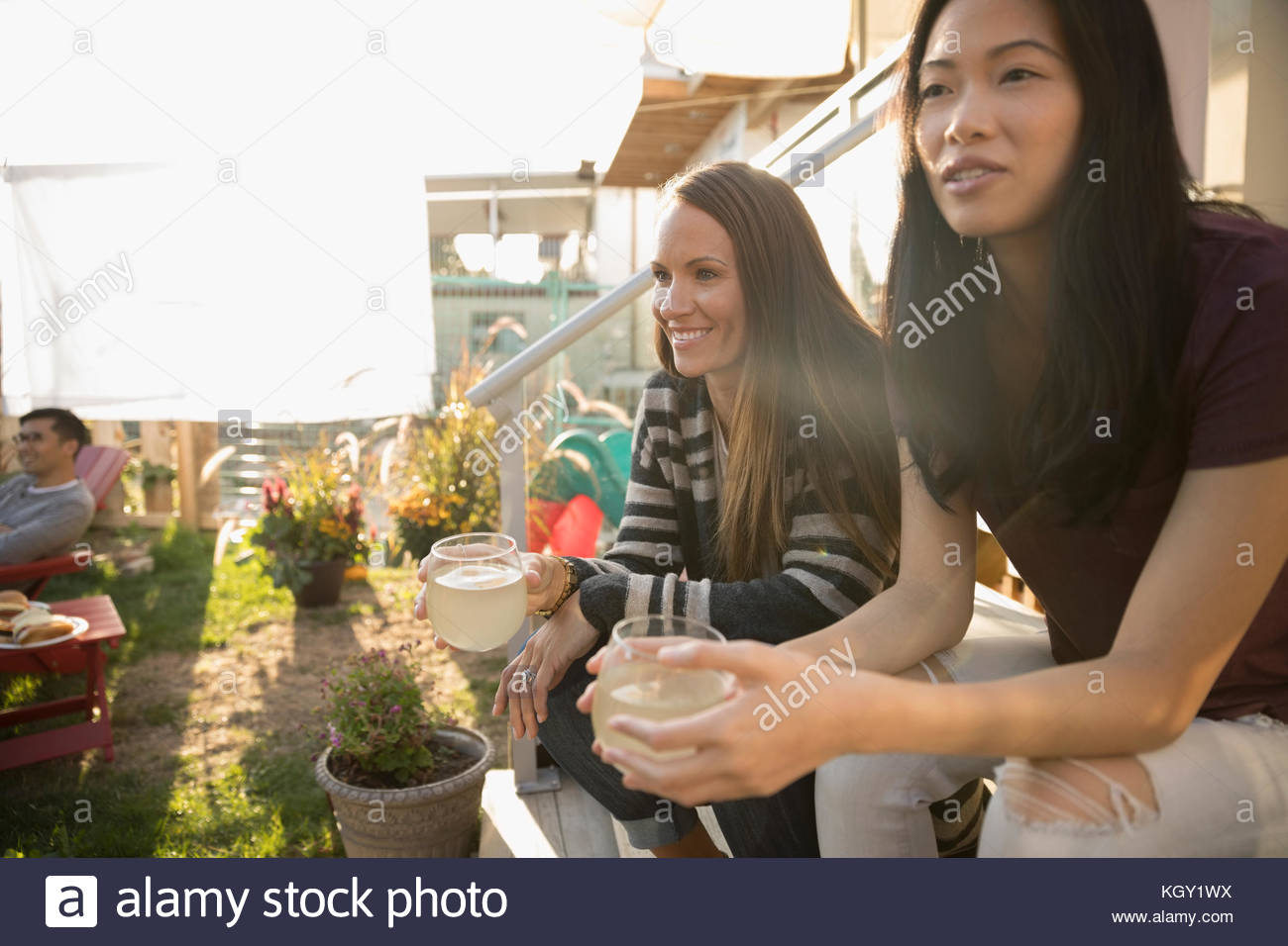 Women friends drinking lemonade at backyard summer barbecue Stock Photo ...