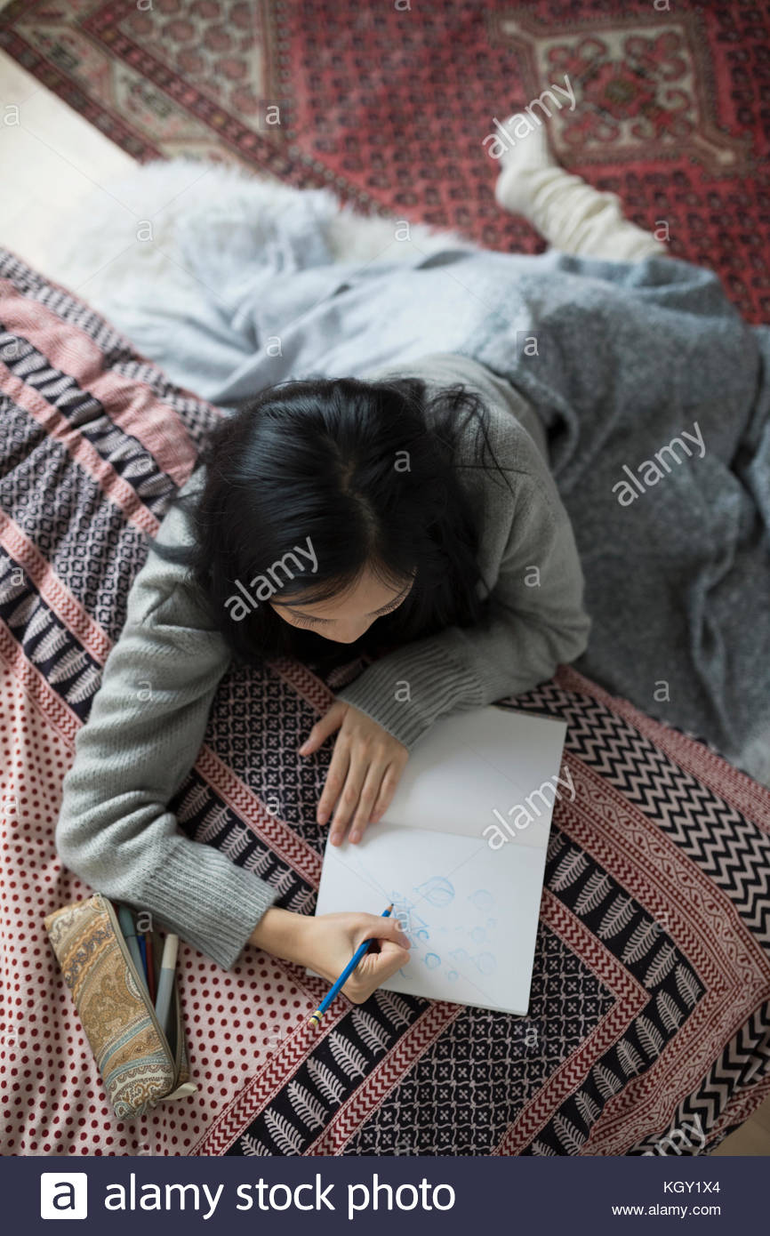 Woman drawing in notebook hi-res stock photography and images - Alamy