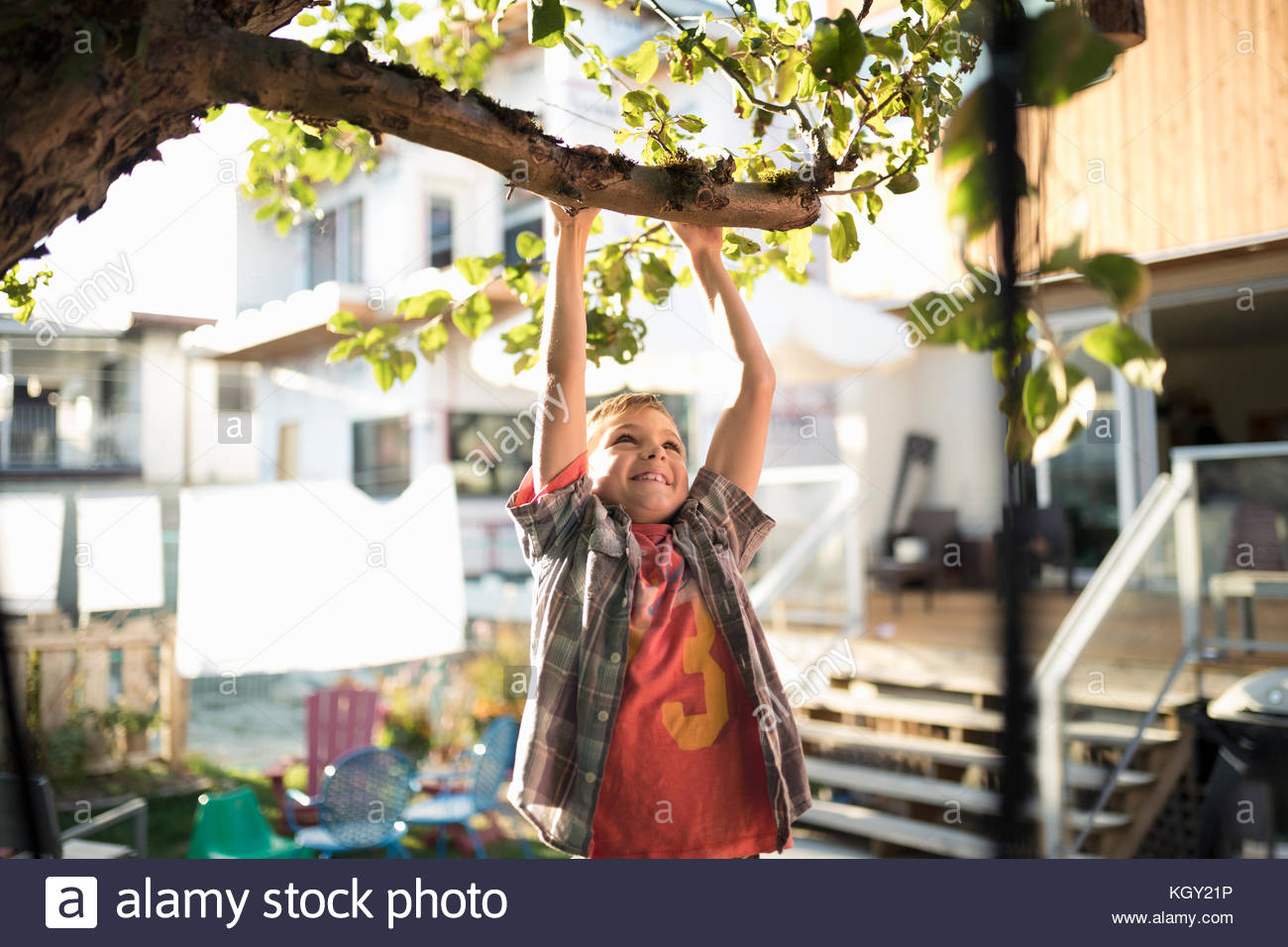 Boy climbing tree boys hi-res stock photography and images - Alamy