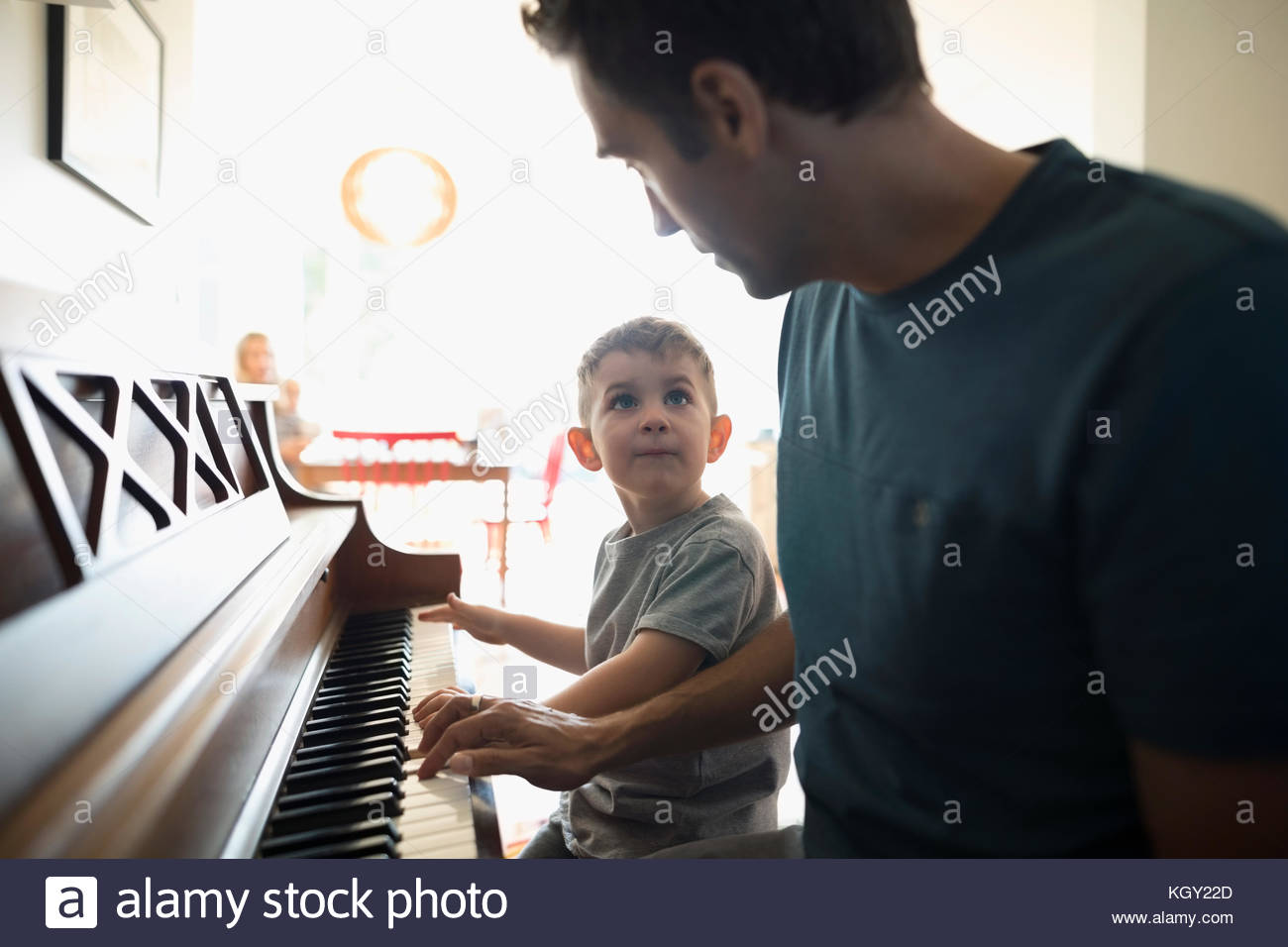 Father playing music and his son hi-res stock photography and images ...