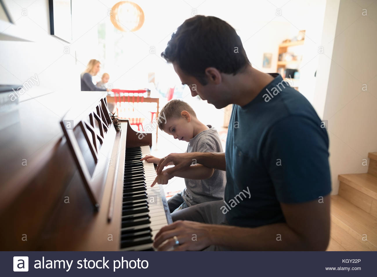 Father and son playing piano hi-res stock photography and images - Alamy