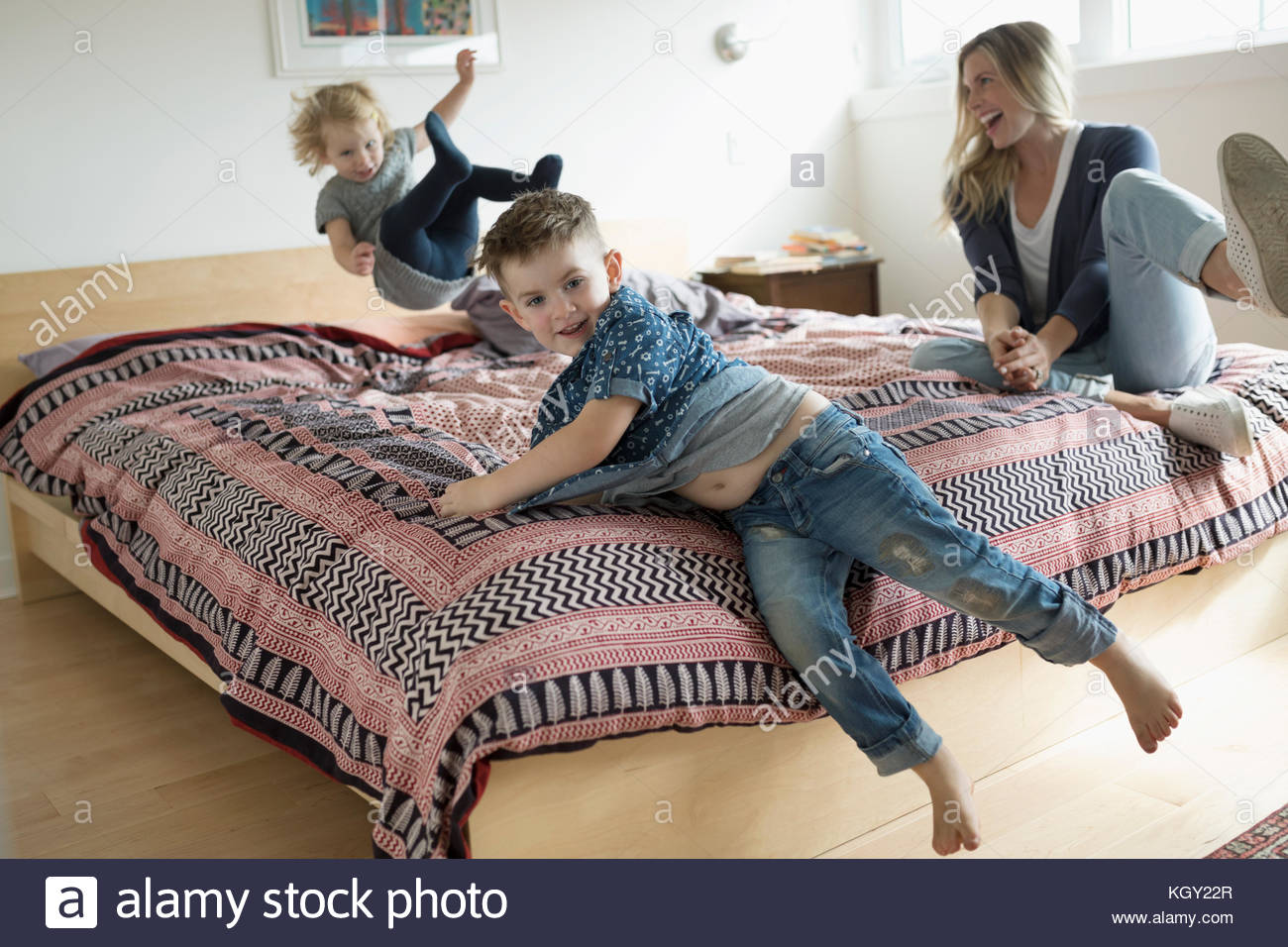 Children jumping on bed hi-res stock photography and images - Alamy