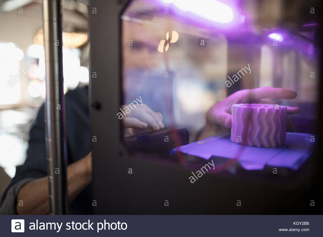 Close up male designer using 3D printer Stock Photo - Alamy