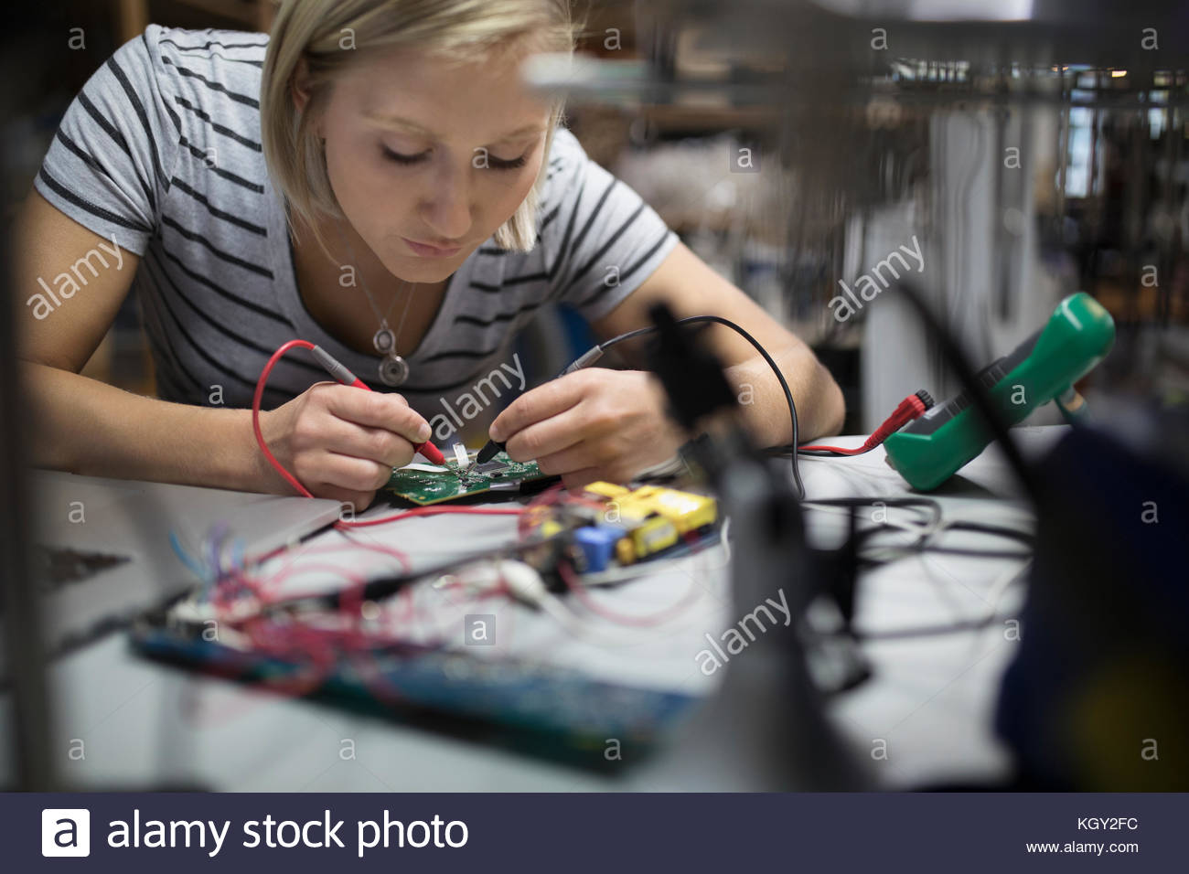 Woman using soldering iron hi-res stock photography and images - Alamy