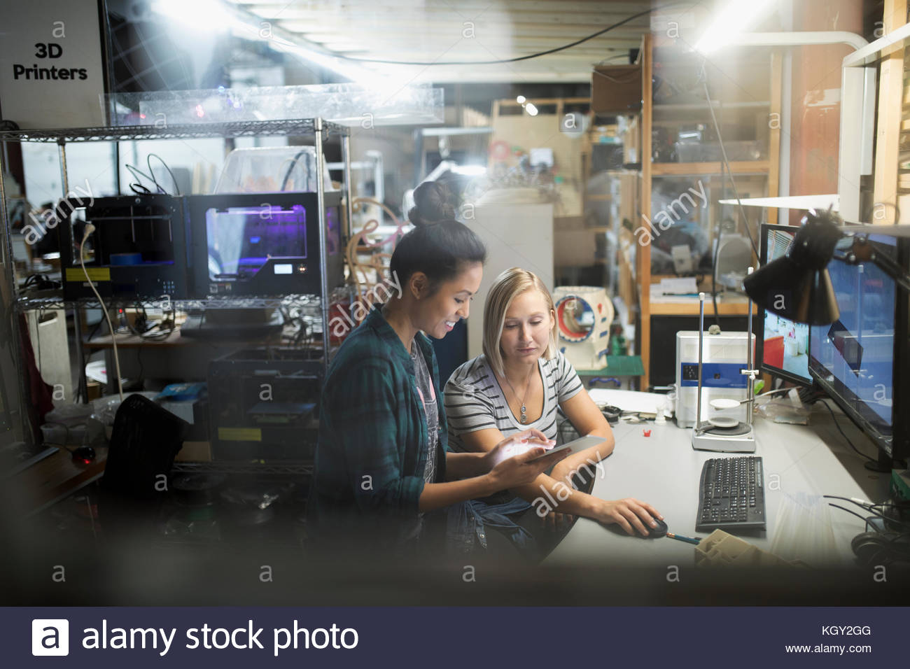 Two engineers looking at computer hi-res stock photography and images ...