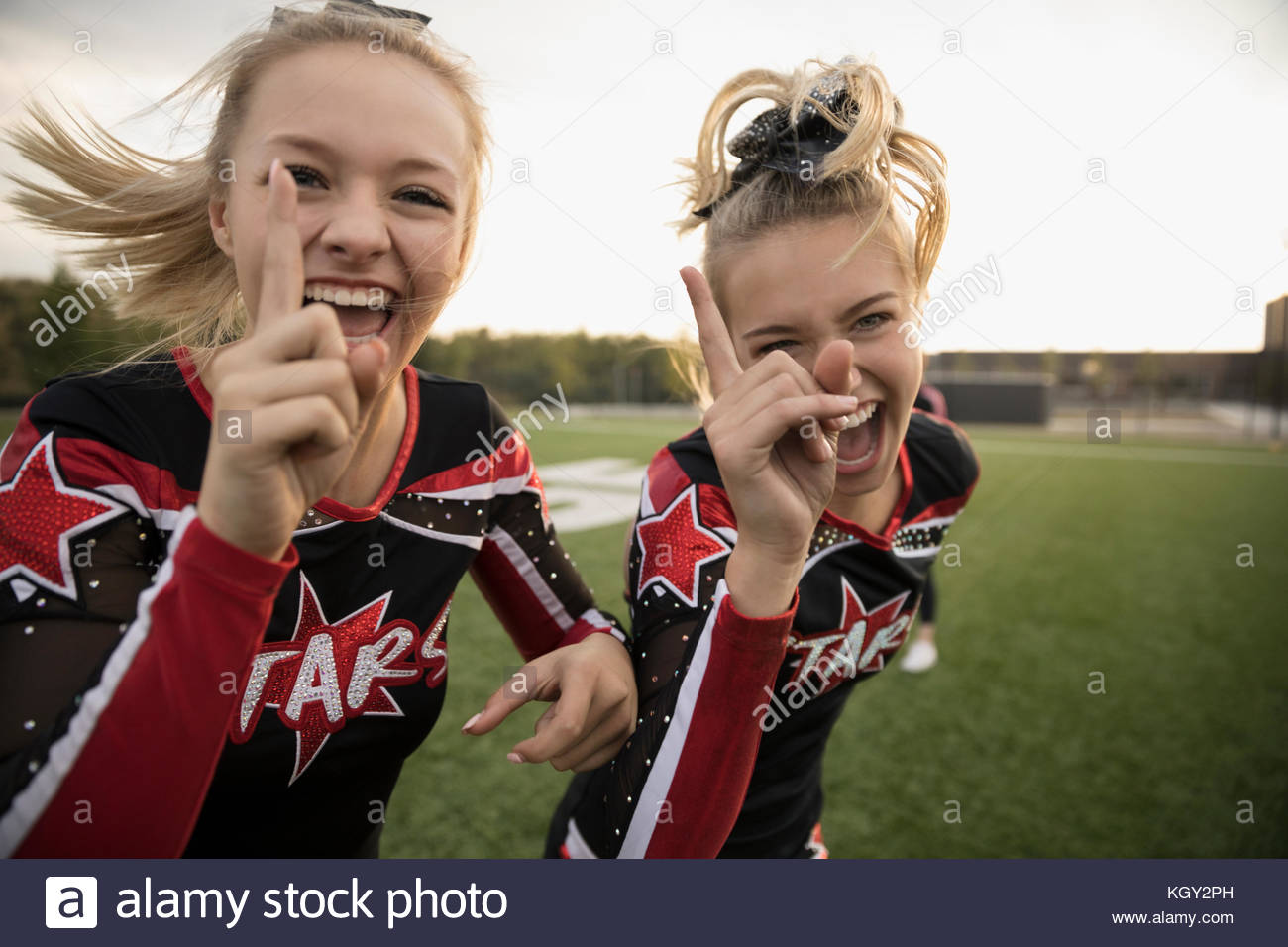 Portrait enthusiastic teenage girl high school cheerleading team ...