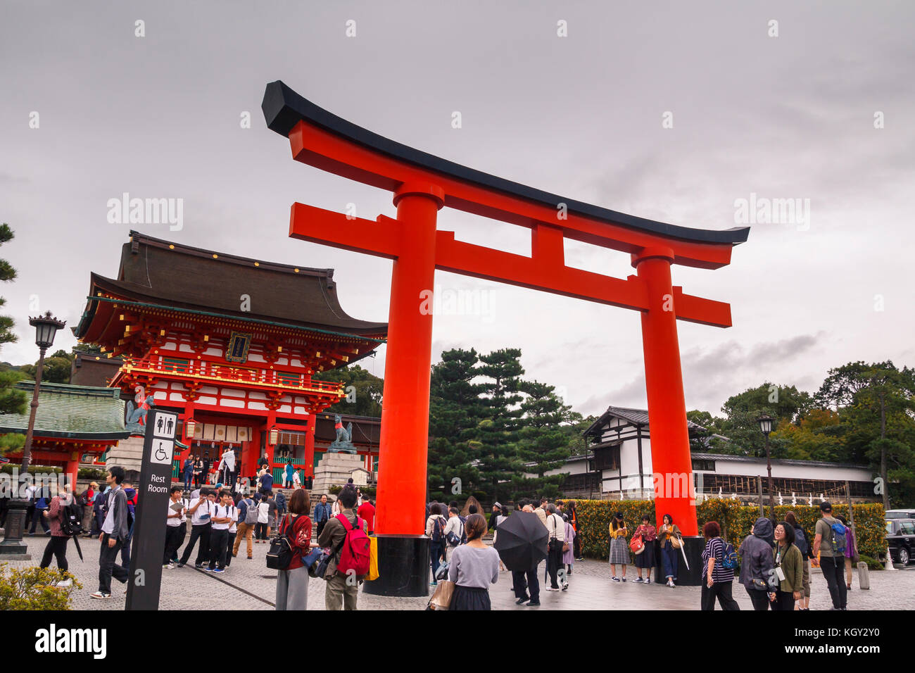 Lots of tourists visting the main entrance of Fushimi inari, with the ...